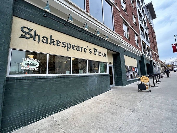 The iconic green storefront of Shakespeare's Pizza stands like a culinary landmark in downtown Columbia, where literary references and perfect pies have been drawing crowds for decades.