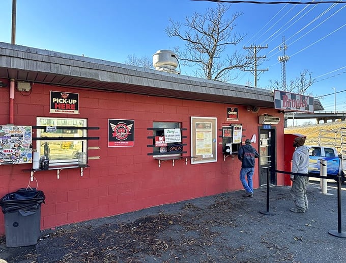 That bright red building isn't just eye-catching, it's a beacon calling hungry souls to burger paradise.