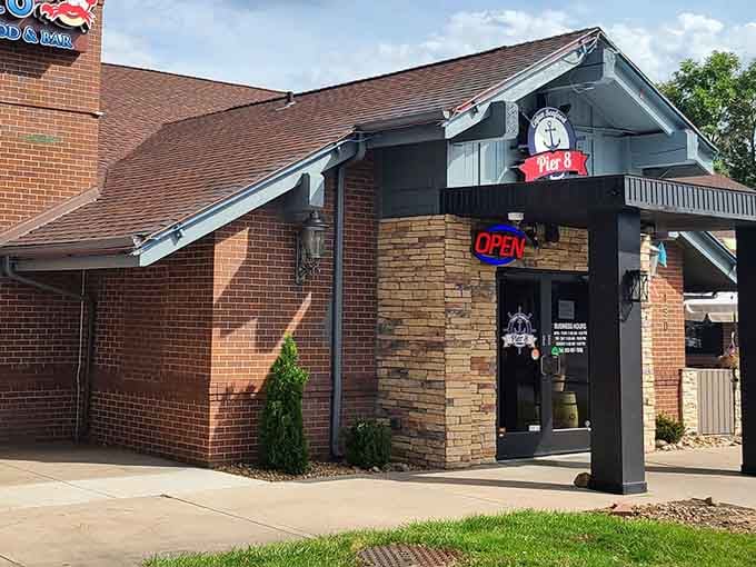 That glowing "OPEN" sign is your beacon to authentic Cajun seafood in the most unexpected Colorado location.