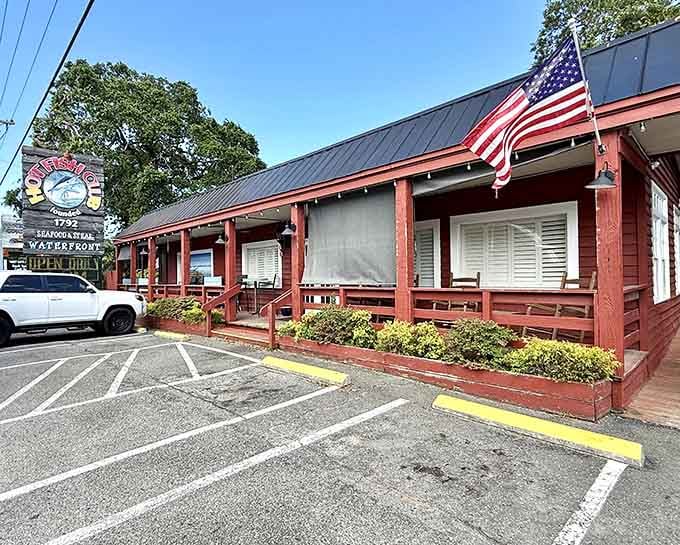 That cheerful sign and waterfront location are your first clues that something delicious is about to happen here.