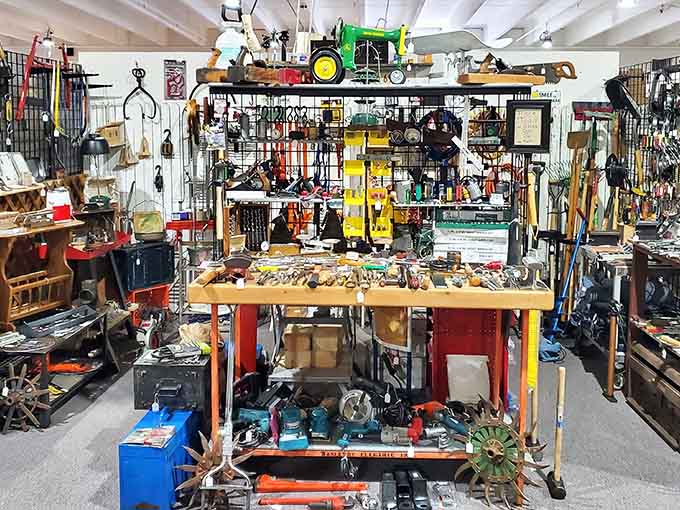 A handyman's paradise! This booth transforms ordinary tools into a museum of American craftsmanship, complete with a John Deere tractor keeping watch from above.