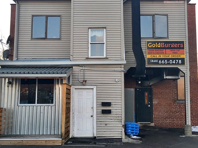 The golden letters against brick say it all: unpretentious, straightforward, and promising burger bliss that keeps locals coming back.