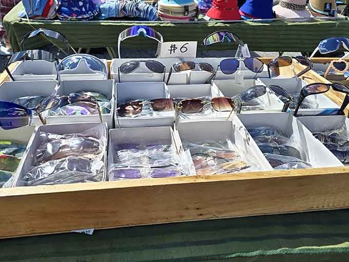 Sunglasses organized by the dozen because everyone needs backup shades for when summer decides to show up.