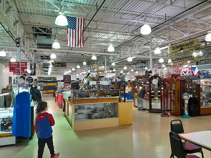 American flags and hanging lights create the perfect backdrop for this miniature museum of memories, where yesterday's ordinary becomes today's extraordinary find.
