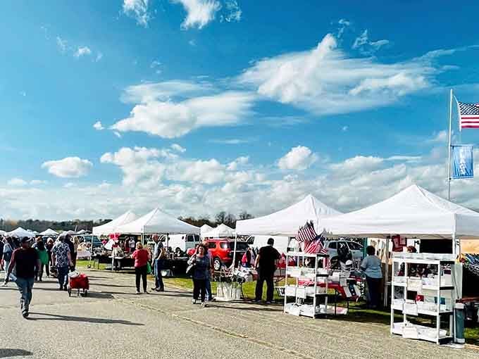 White tents stretching toward the horizon under blue skies, where treasure hunters gather for the ultimate shopping adventure.