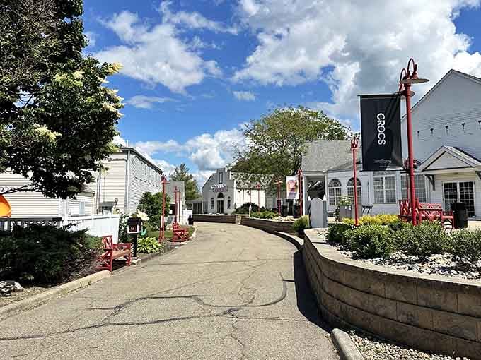 Those red lampposts and winding walkways create a shopping experience that feels less like a mall, more like a stroll.