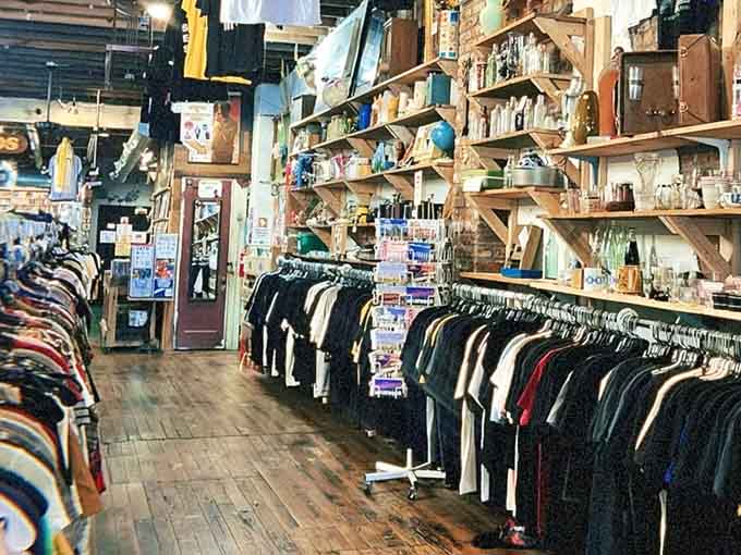 Inside Fat Rabbit's wonderland: vintage clothing racks line wooden floors while shelves overflow with decades of curious treasures waiting to be discovered.