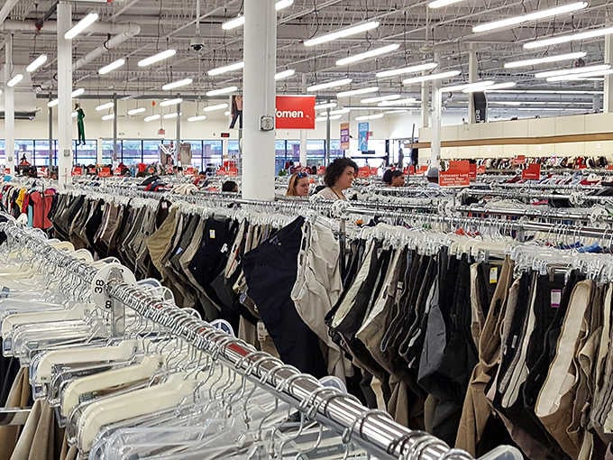 The pants section alone could outfit a small nation. Shoppers navigate this denim sea with the focused determination of bargain-hunting explorers.