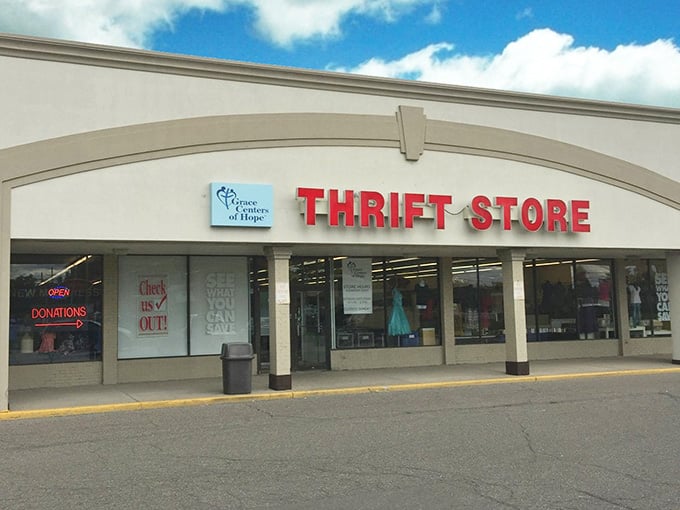 "Donations" sign glows like a homing beacon for declutterers, while "Check Us Out!" invites the curious to discover secondhand gold.