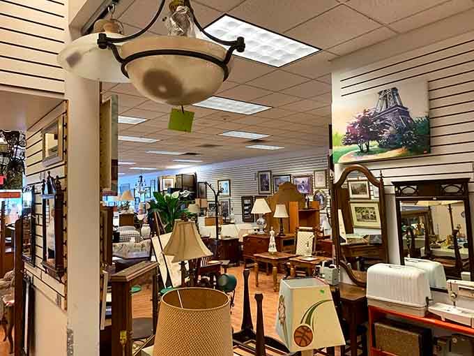 Lamps, mirrors, and home d&eacute;cor treasures await discovery in this meticulously organized section of Care & Share's vast inventory.
