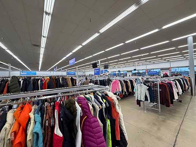 The expansive clothing section showcases 2nd Ave's impressive inventory, with colorful winter coats and everyday fashion organized by type and size.