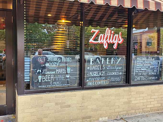 Window art at Zaftigs reveals the deli's expansive offerings beyond those famous potato pancakes &ndash; from bagels to mimosas, it's a chalkboard symphony of comfort food possibilities.