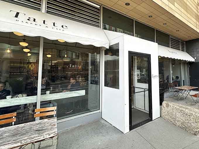 The entrance beckons with that classic awning, offering a little slice of continental breakfast culture right here in Massachusetts.