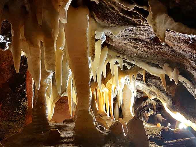 These golden stalactites look like they're dripping honey, except they've been forming for thousands of years instead of hours.
