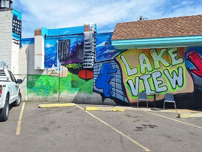 That vibrant mural isn't just street art&mdash;it's a neon welcome mat announcing you've arrived somewhere special.