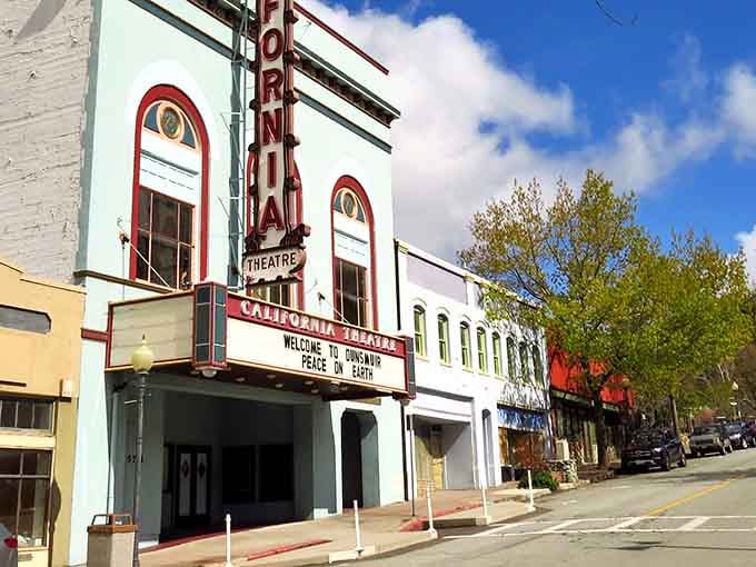 The California Theatre's mint-green facade and vintage marquee transport you to a time when movie tickets cost less than your morning latte.