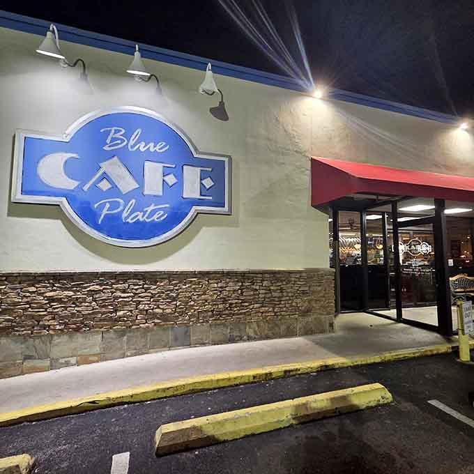 That cheerful blue and red awning glows like a beacon, welcoming you home to a cozy night dining experience.