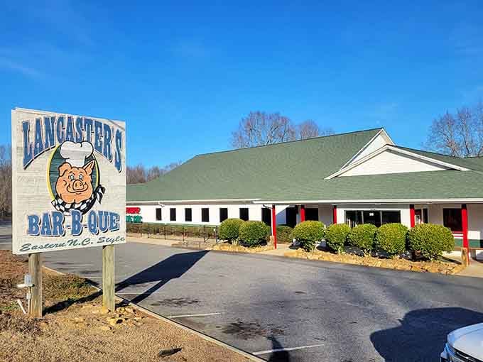 This BBQ joint greets you with a vibrant sign, offering delicious and authentic North Carolina barbecue.