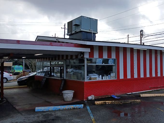 The iconic red and white striped awning of Shady Lane Drive Inn stands as a beacon of hope for hungry travelers and locals alike. Simple perfection awaits.