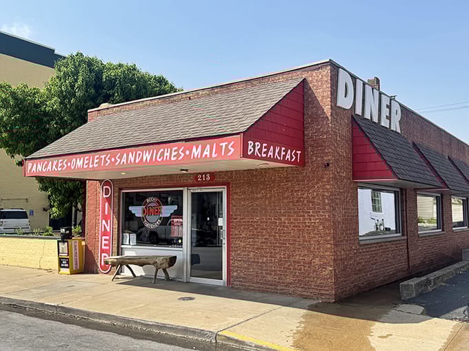 Red brick meets classic diner charm where the "DINER" sign towers overhead like a delicious landmark you can't miss.