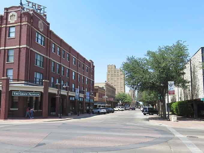 Tree-lined avenues lead past the Grace Museum toward historic towers, proving small cities can have big character.