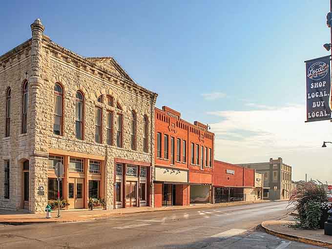 Historic downtown Stephenville showcases beautifully preserved limestone and brick buildings, where local shops thrive under the "Shop Local" banner.