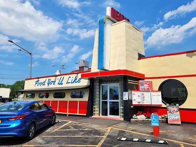 That red and cream exterior isn't just eye candy, it's a time machine to when diners actually looked like diners.