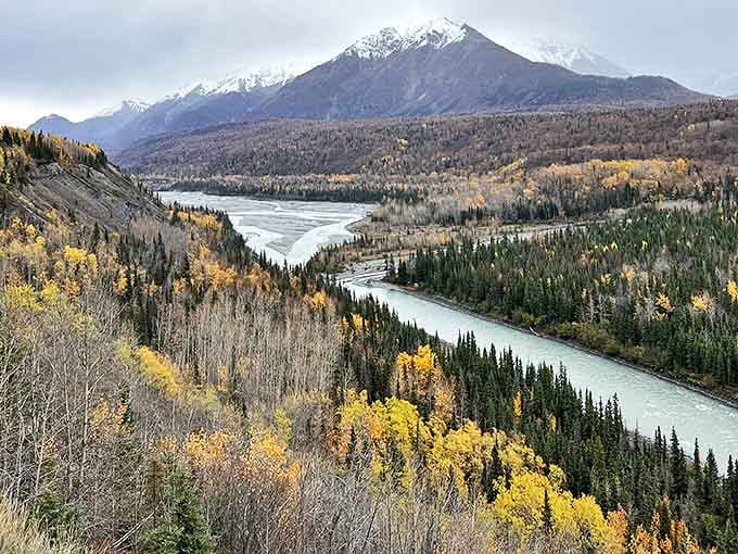 The mighty Matanuska River winds through the valley, carved by glacial meltwater over millennia, showcasing Alaska's dramatic seasonal beauty.