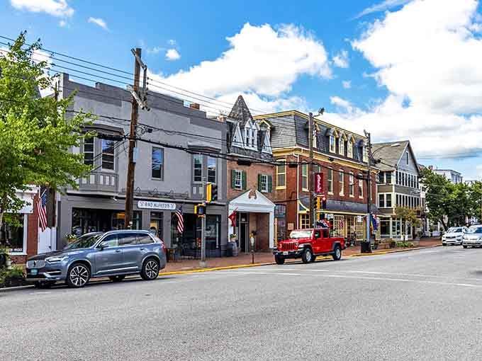 Historic storefronts line High Street where architecture meets actual commerce instead of Instagram opportunities.
