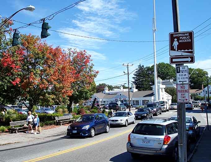 Fall in Mystic brings a painter's palette to life, with crimson trees standing guard over streets where New England charm flows as freely as the nearby river.