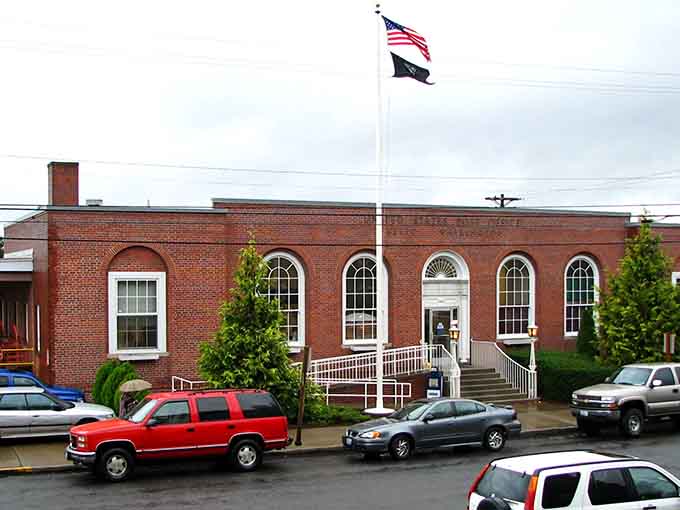 Classic brick architecture and the American flag flying proudly showcase Kelso's commitment to preserving its historic character and community pride.