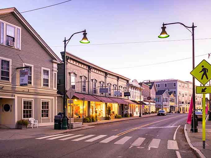 Twilight transforms Mystic's main street into a Norman Rockwell painting come to life, where shop windows glow with invitation and possibility.