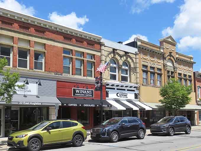 Classic storefronts with ornate cornices prove that downtown architecture peaked somewhere around 1920 and never looked back.