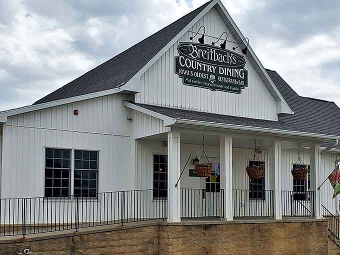 Iowa's oldest restaurant stands proudly against the sky, its iconic sign proclaiming a legacy of hospitality that spans generations.