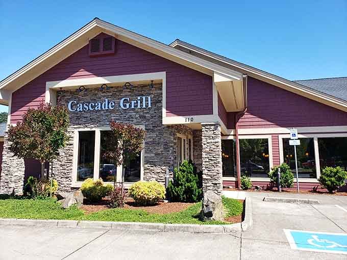 The distinctive burgundy exterior of Cascade Grill welcomes hungry travelers like a culinary lighthouse guiding you to prime rib paradise.