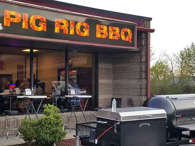 The glowing Pig Rig BBQ sign beckons like a smoky lighthouse for the hungry and barbecue-deprived souls of Connecticut.