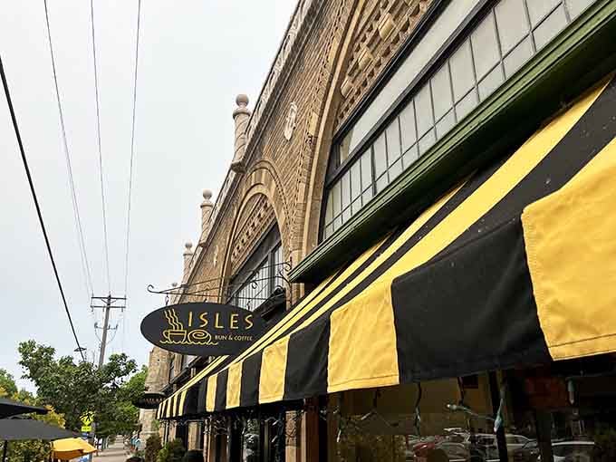 That distinctive yellow and black awning is like nature's warning coloration: approach with caution, leave with cinnamon-scented happiness and zero regrets.