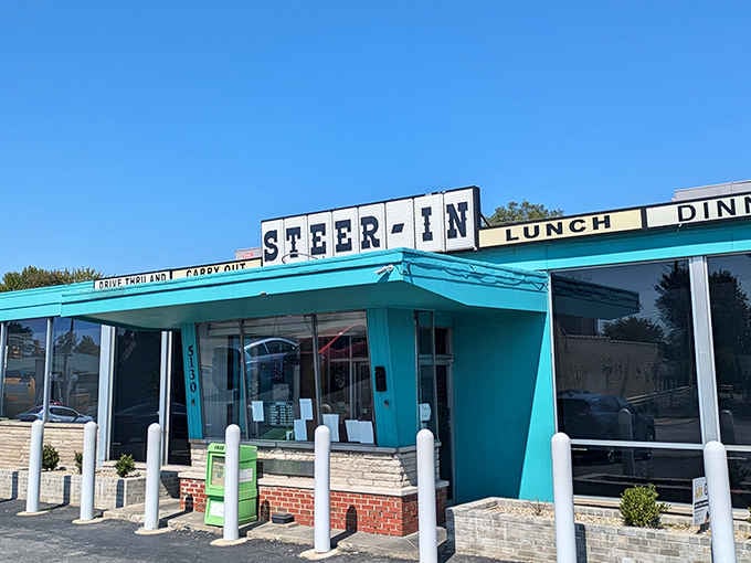 That turquoise exterior isn't just pretty, it's a beacon calling you home to burger paradise.