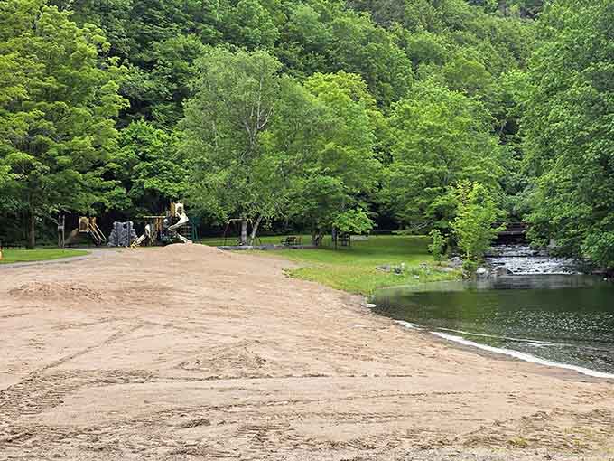 That sandy beach and crystal-clear creek prove paradise doesn't require an ocean or a passport.