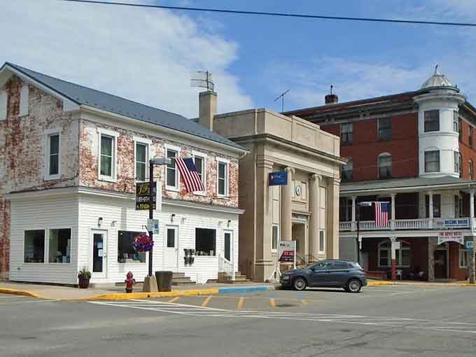 American flags wave proudly over buildings that have witnessed more history than your high school textbook ever covered.