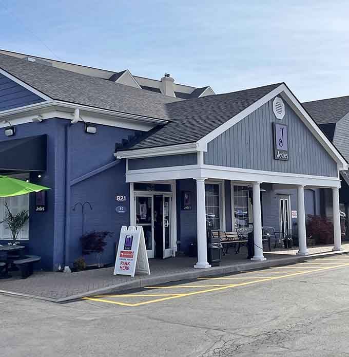 That charming blue exterior with the welcoming porch is your first sign that something special awaits inside.