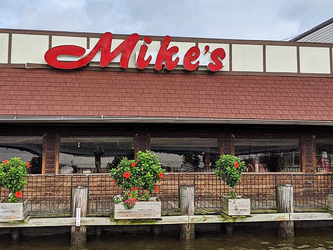 That waterfront deck isn't just a dining area, it's your front-row seat to the South River show.