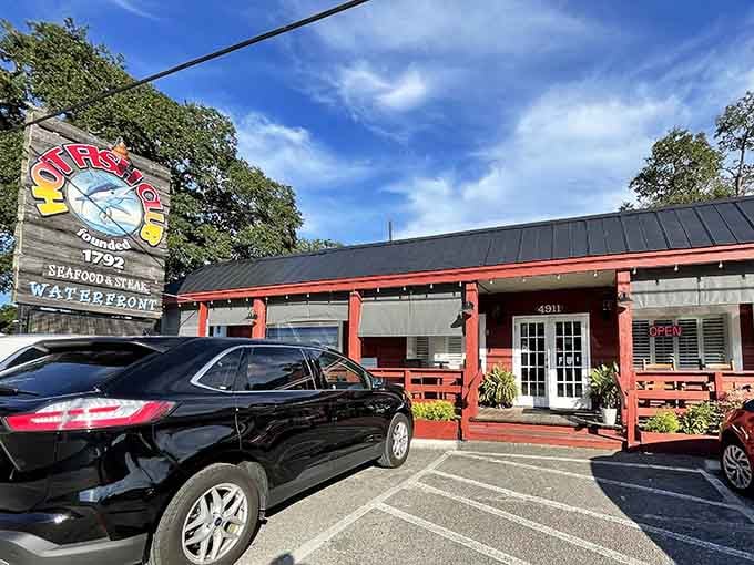 That cheerful sign and waterfront location are your first clues that something delicious is about to happen here.