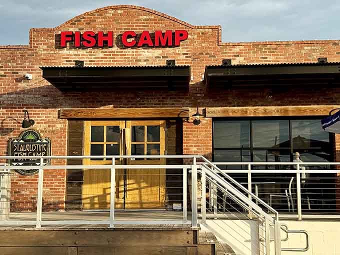 The brick facade with its bold red "FISH CAMP" sign promises exactly what you'll find inside: straightforward, delicious seafood without pretension.