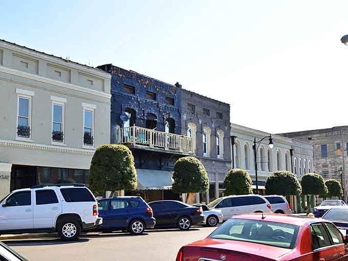 Historic storefronts line Corinth's downtown, where perfectly shaped topiary trees stand like green sentinels guarding the town's rich past. Window shopping here feels like time travel.