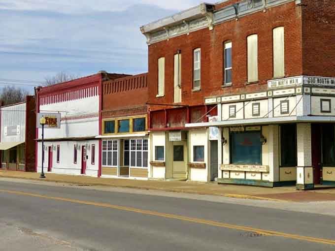 Classic small-town storefronts where the architecture tells stories and the awnings provide actual shade instead of ironic ambiance.
