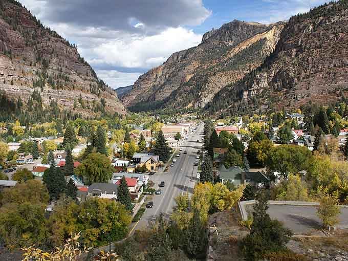 Mountains cradle this Victorian gem like nature's own jewelry box, proving Colorado knows how to frame a town.
