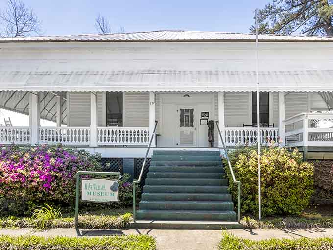 The white clapboard exterior whispers Southern charm while those front steps have welcomed pilgrims from around the world.