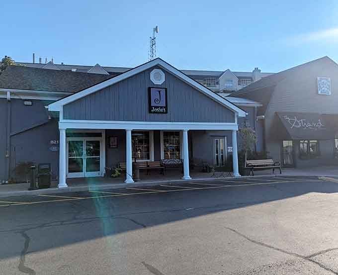 That charming blue exterior with the welcoming porch is your first sign that something special awaits inside.