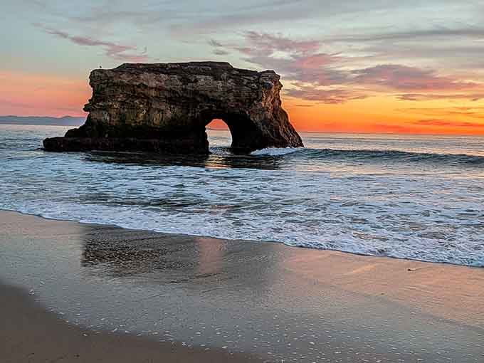 That sunset glow hitting the arch makes it look like nature's own stained glass window.